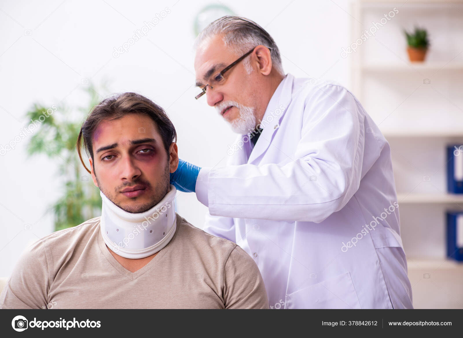 Young face injured man visiting experienced male doctor traumato ...