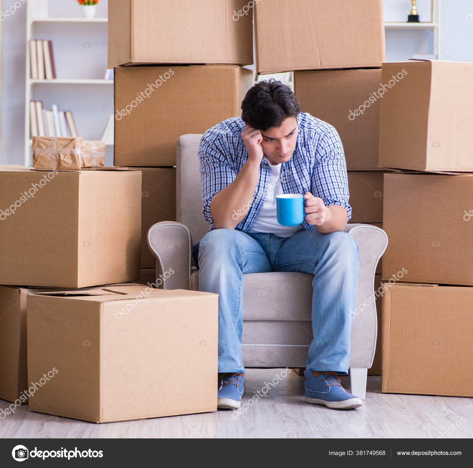 Young man moving in to new house with boxes Stock Photo by ©Elnur ...