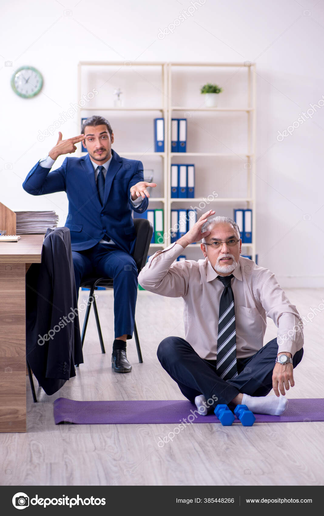 Two employees doing physical exercises at workplace — Stock Photo ...