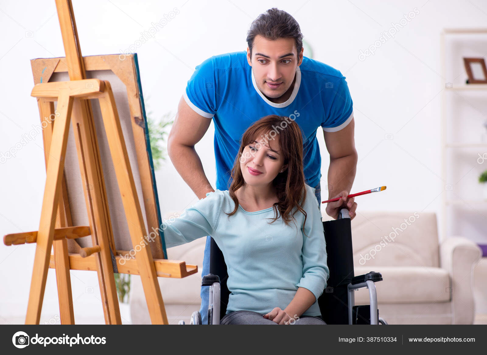 Disabled wife and young husband at home — Stock Photo © Elnur_ #387510334
