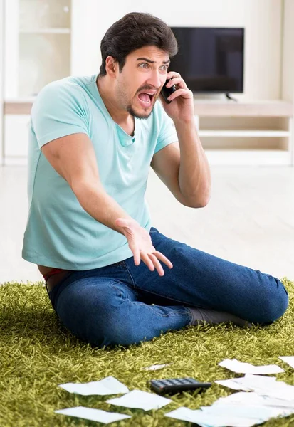 Young man struggling with personal finance and bills - Stock Image ...