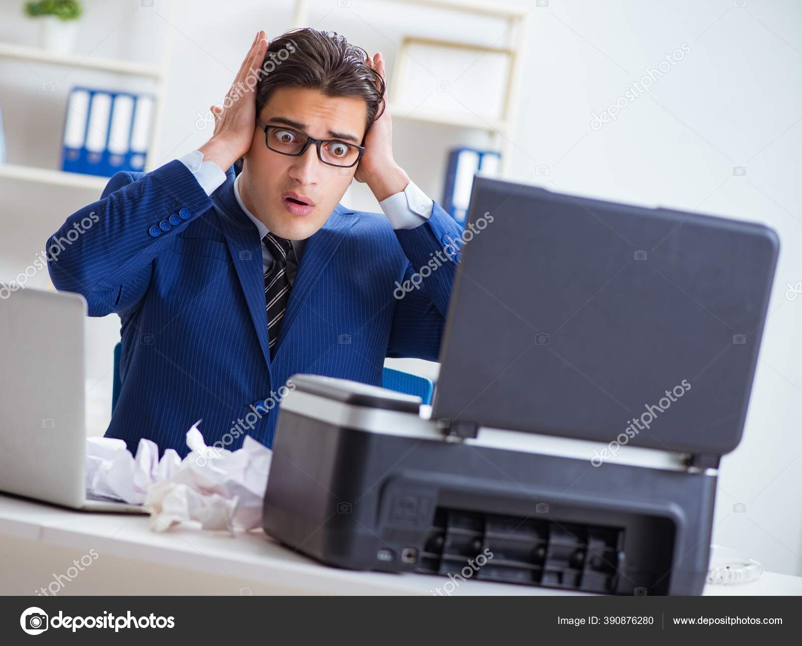 Businessman angry at copying machine jamming papers Stock Photo by ...
