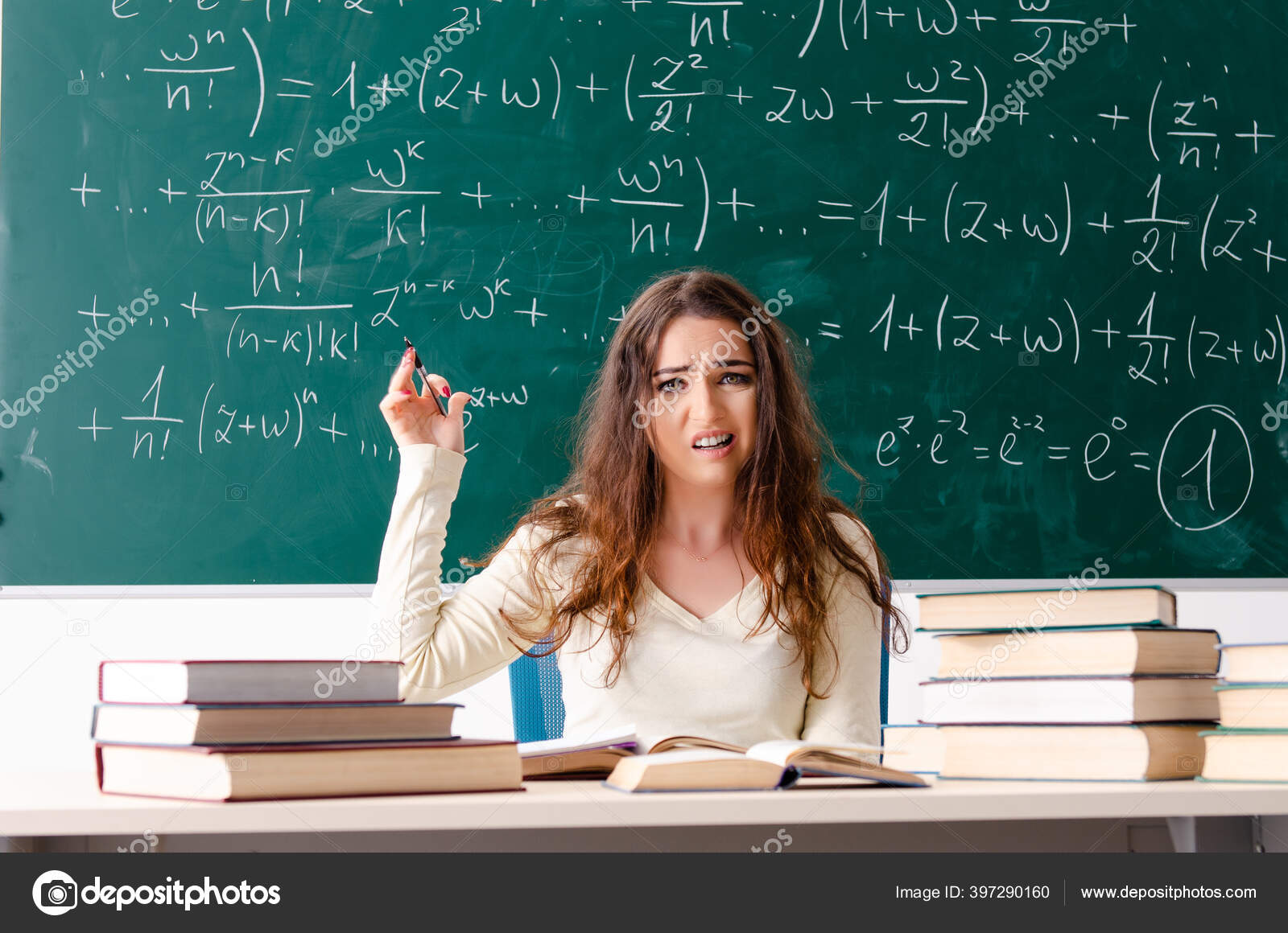 Young female math teacher in front of chalkboard — Stock Photo © Elnur ...