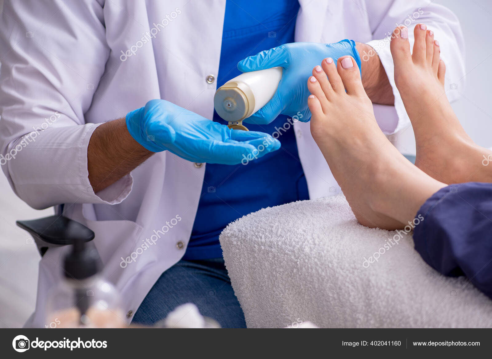 Podiatrist treating feet during procedure Stock Photo by ©Elnur_ 402041160