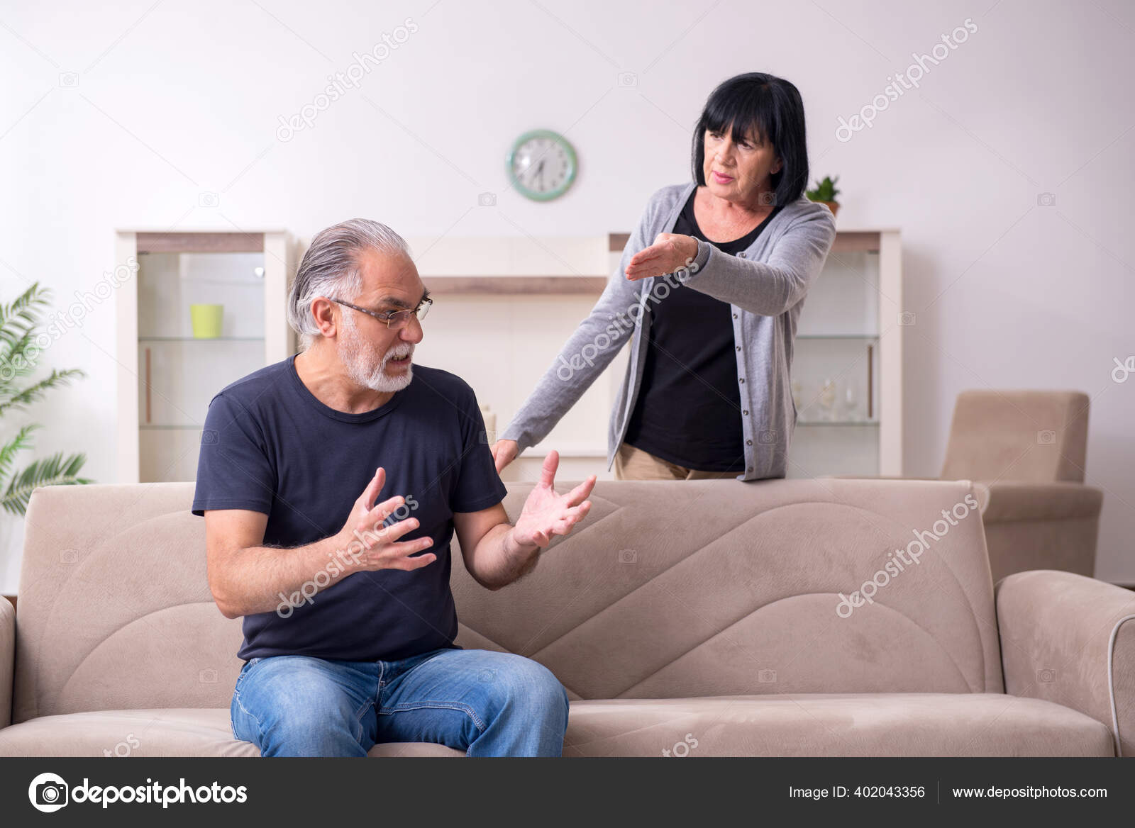 Old couple having argument at home — Stock Photo © Elnur_ #402043356