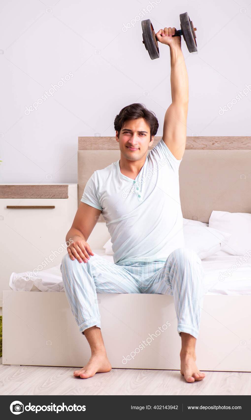 Young man doing morning routine in bedroom — Stock Photo © Elnur ...