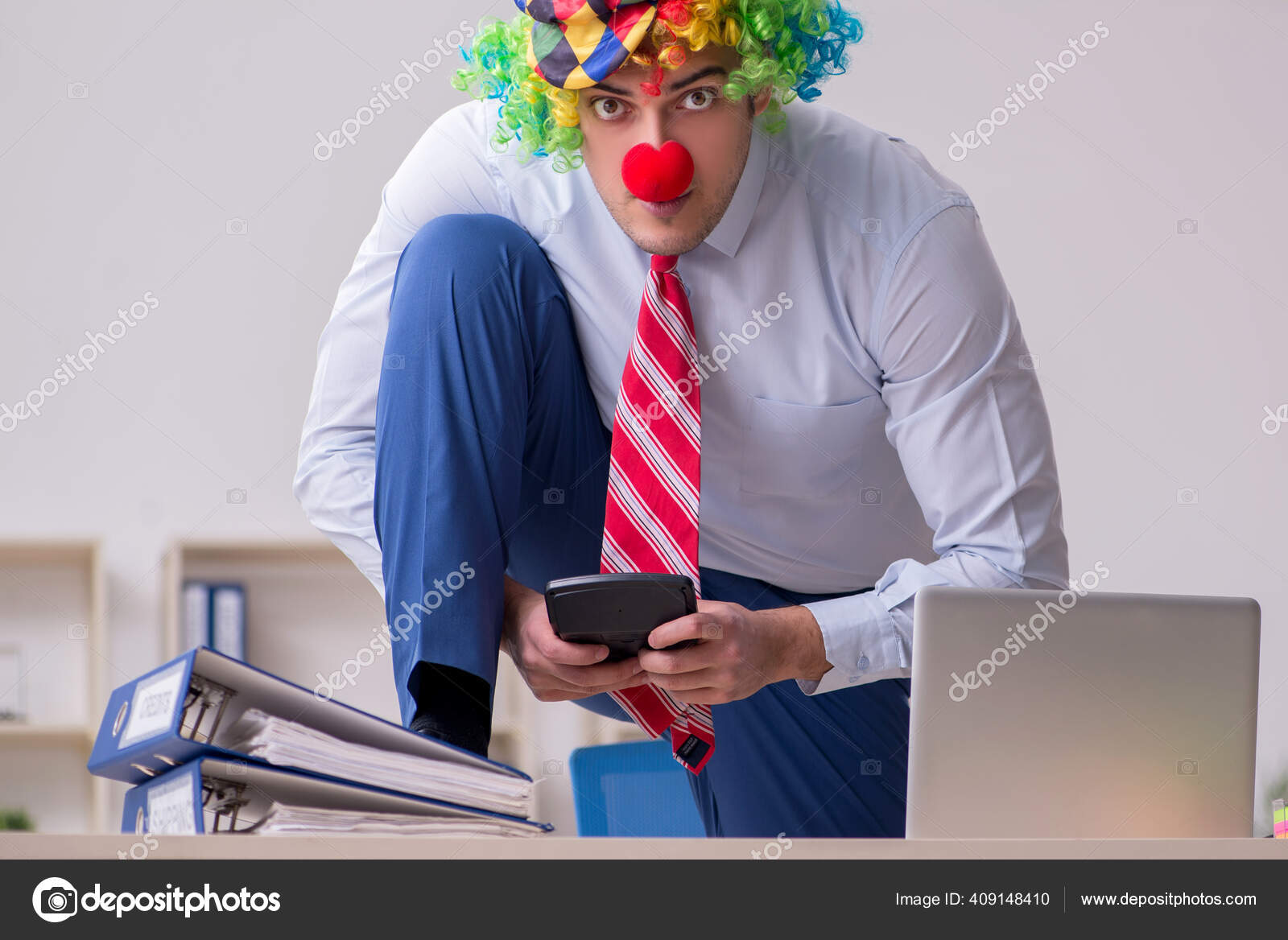 Funny employee clown working in the office — Stock Photo © Elnur ...