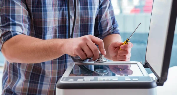 Repairman repairing broken color printer — Stock Photo © Elnur_ #161853198