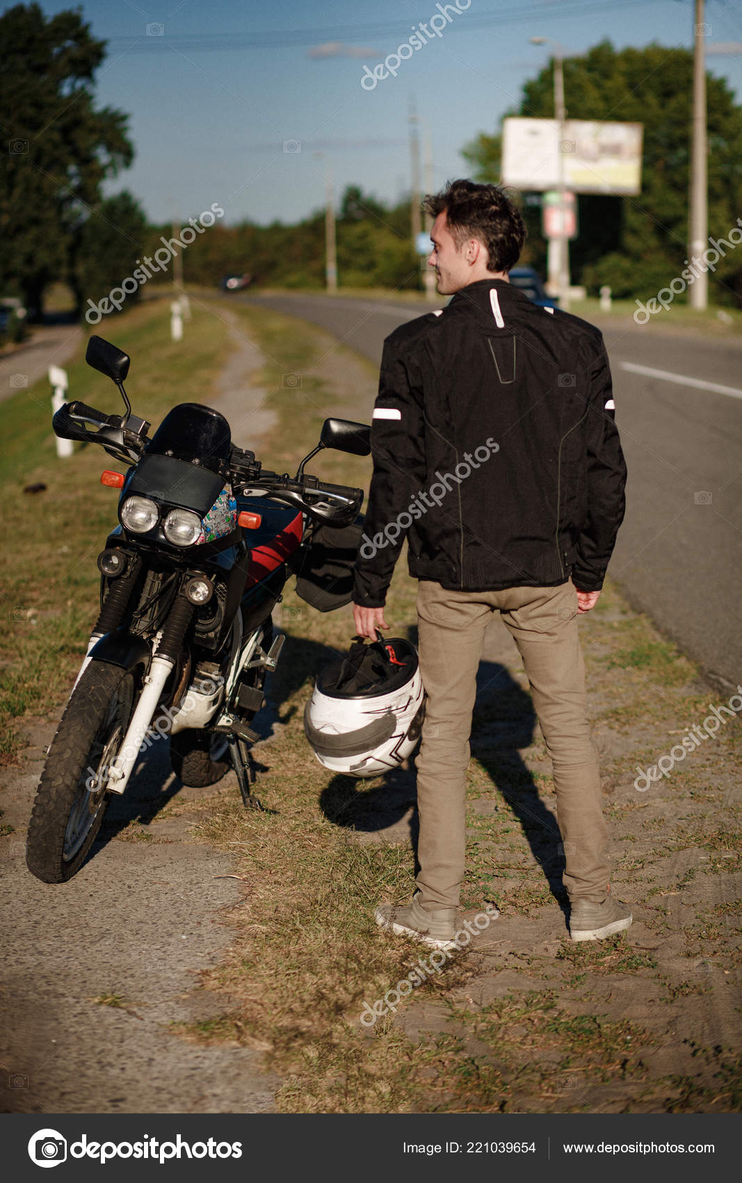 Shot of the bikers back, standing near his motorbike — Stock Photo ...