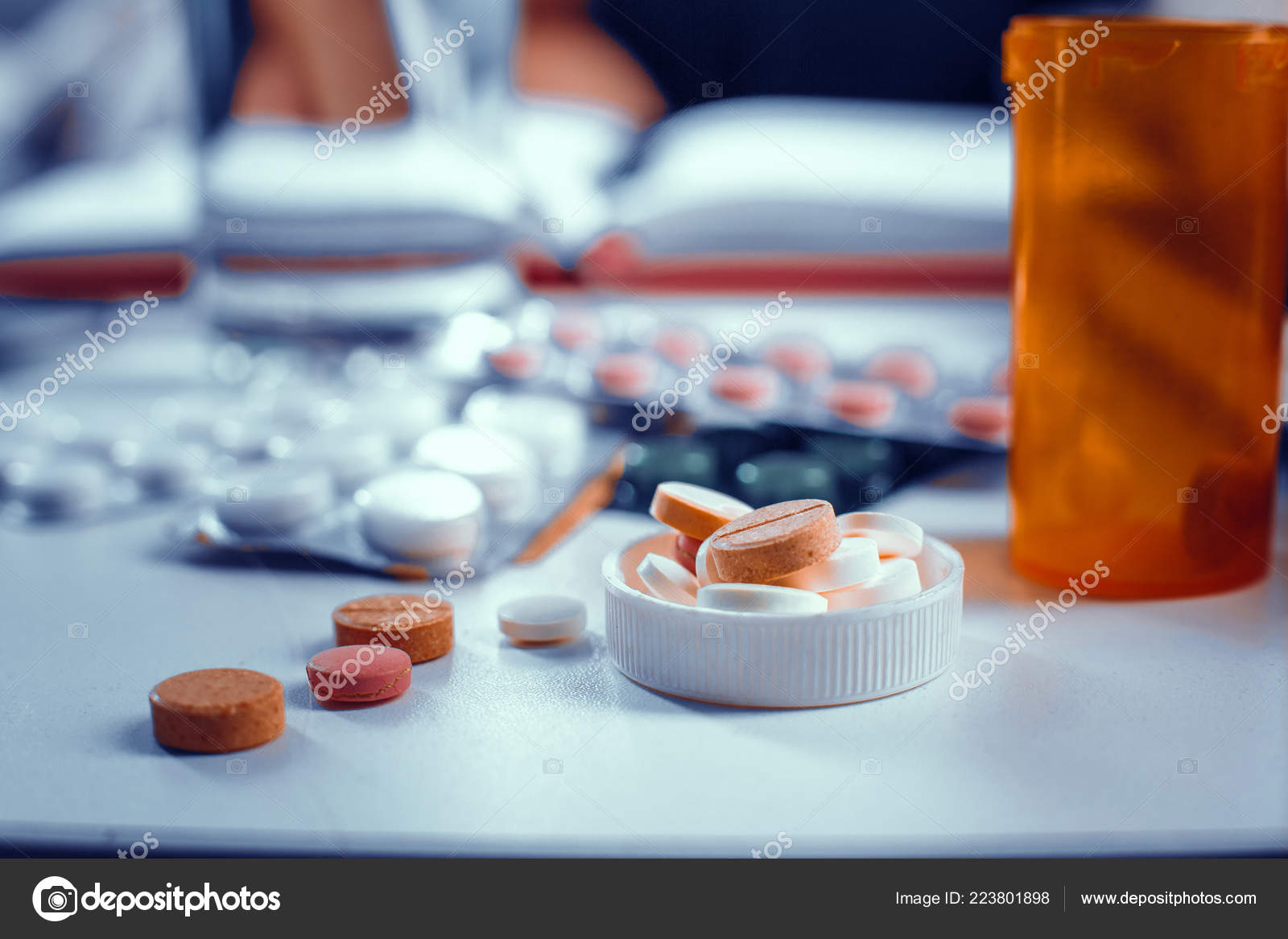 Close-up view on the pills in bottles cap laying on the table — Stock ...