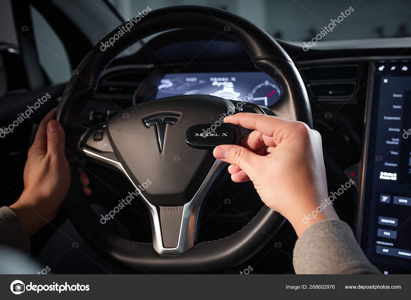 Inside view of Tesla Electric Vehicle. Sreering Wheel and Displays ...