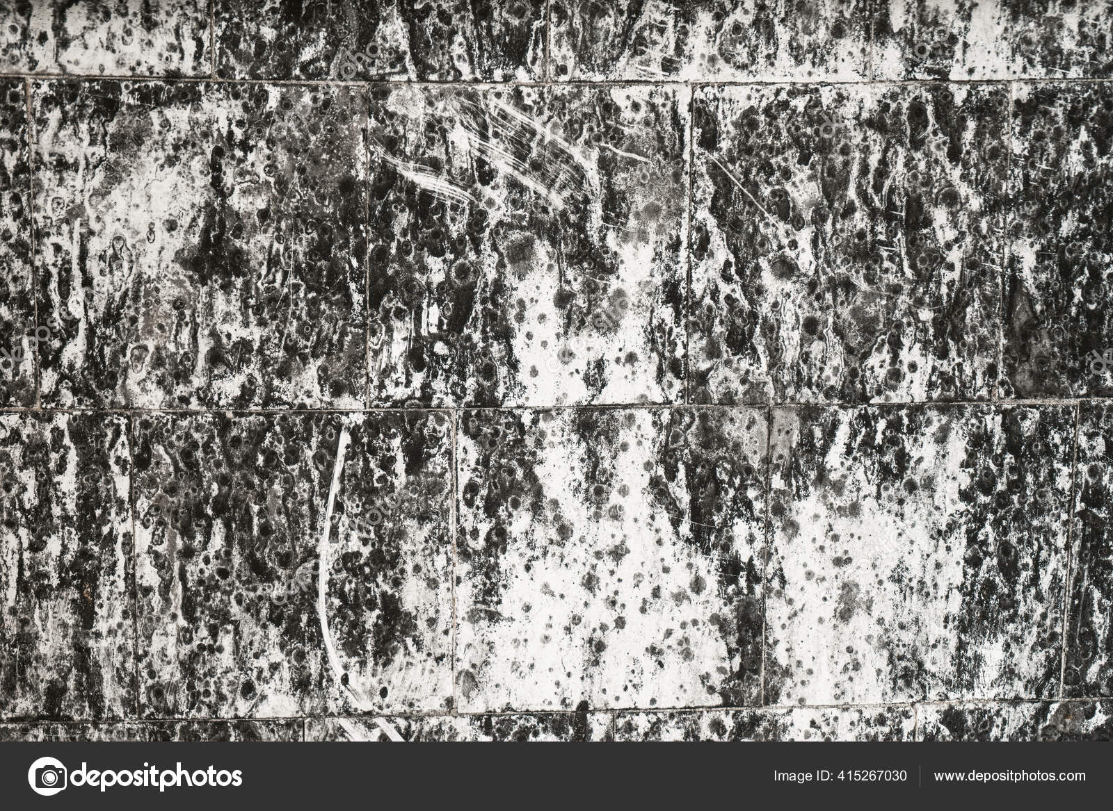 White wall with black spots after the fire. Abstract grunge background ...