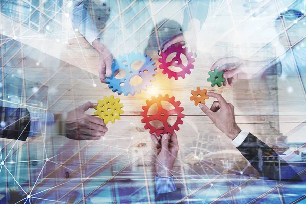 Business team connect pieces of gears. Teamwork, partnership and ...