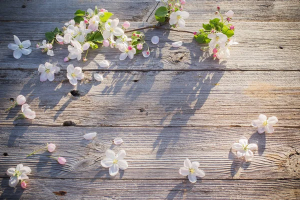 Spring flowers on wooden background Stock Photo by ©Kruchenkova 21336355
