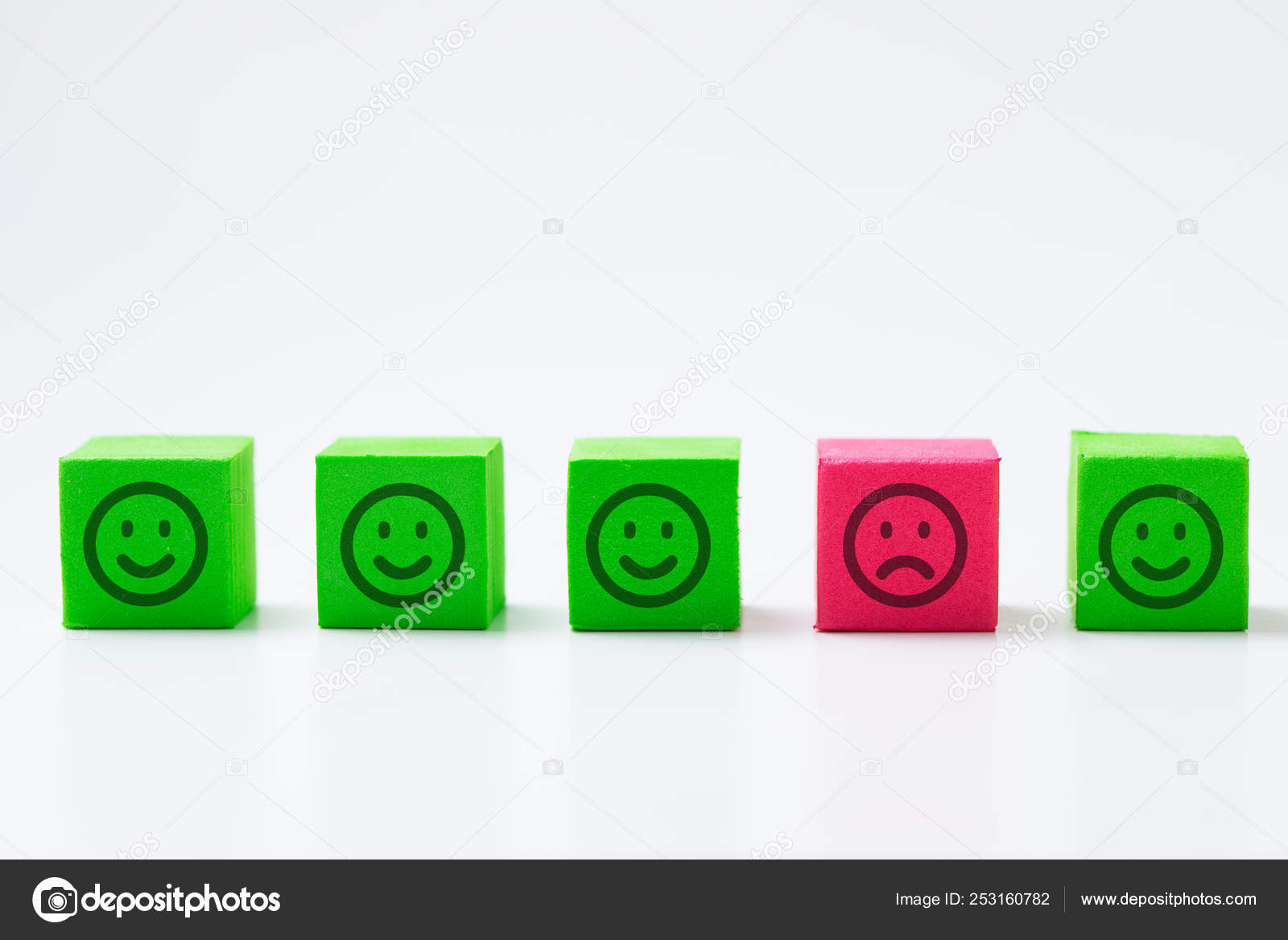 Single sad face among happy smiling faces Stock Photo by ©shirotie ...