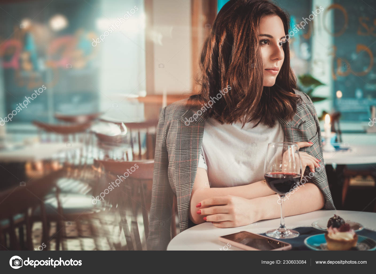 Beautiful woman sitting at the restaurant — Stock Photo © nejron #230603084