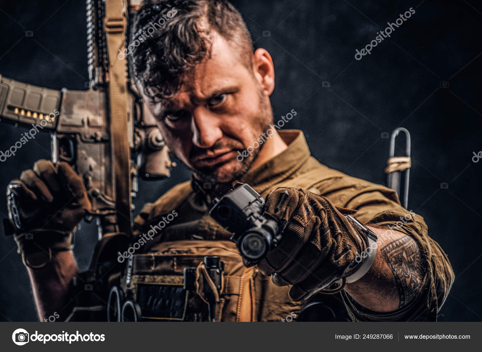 Special forces soldier wearing body armor holding assault rifle and ...