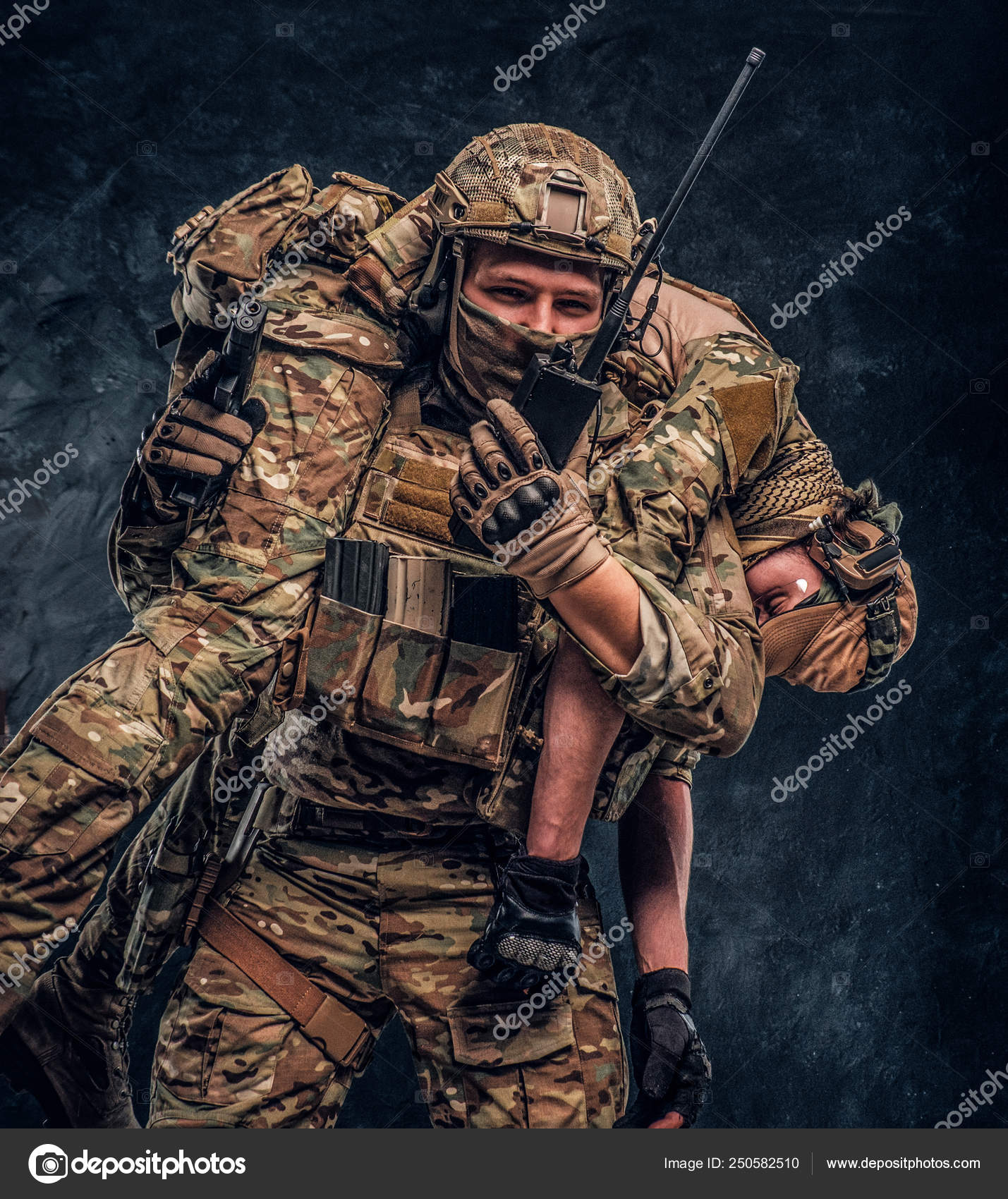 Soldier special forces rescue his wounded teammate carrying him on his ...