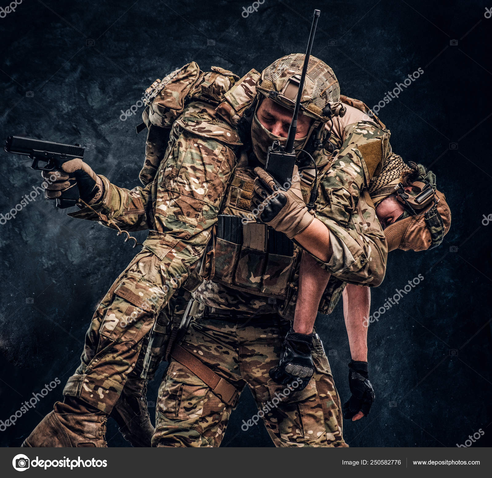 Soldier special forces rescue his wounded teammate carrying him on his ...