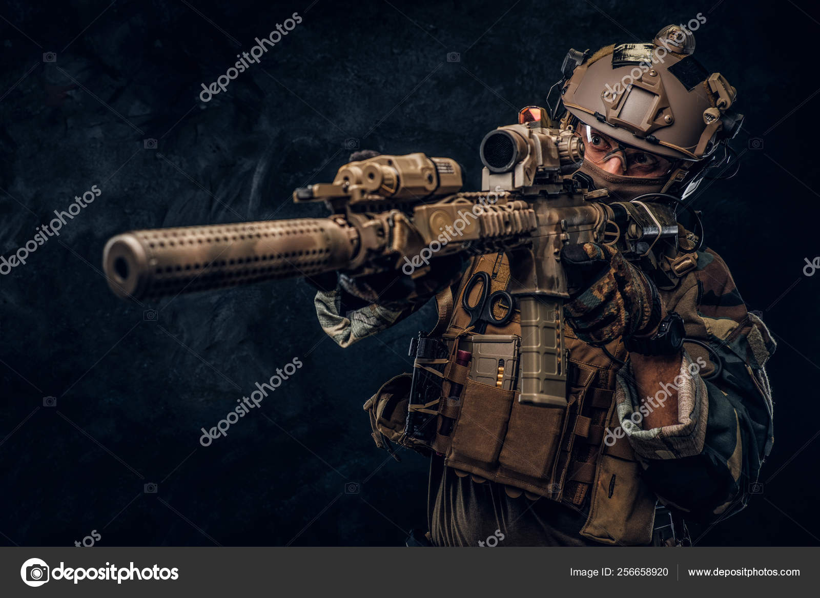 Elite unit, special forces soldier in camouflage uniform holding an ...