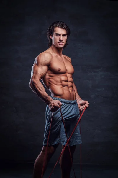 Awesome shirtless bodybuilder in blue shorts. — Stock Photo © fxquadro ...