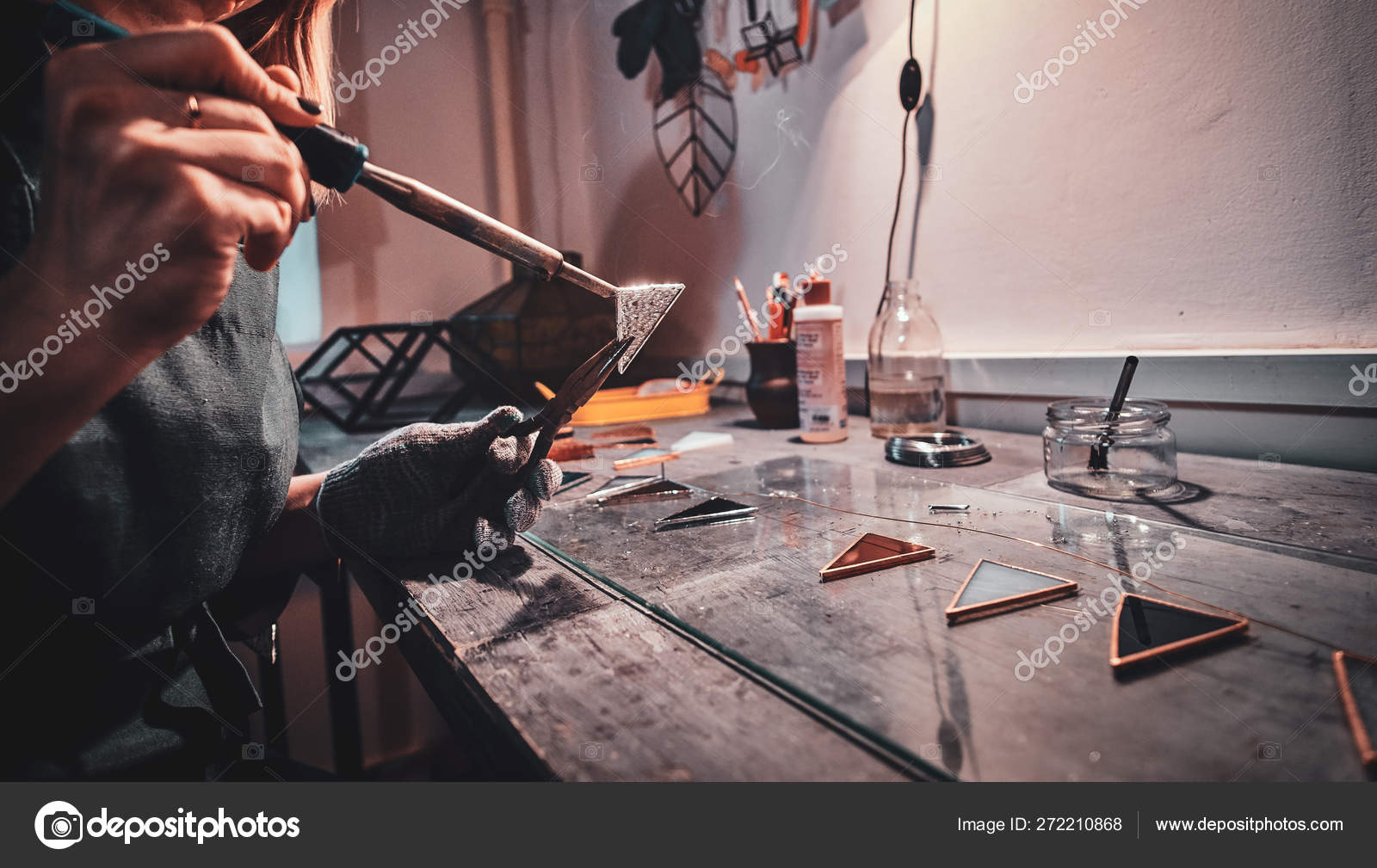 Process of soldering by hands at glass workshop Stock Photo by ...