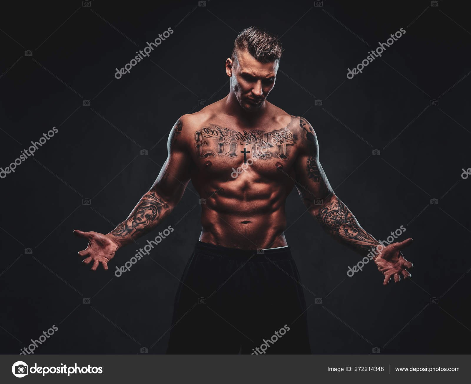 A muscular tattooed man on a dark background. Stock Photo by ©fxquadro ...