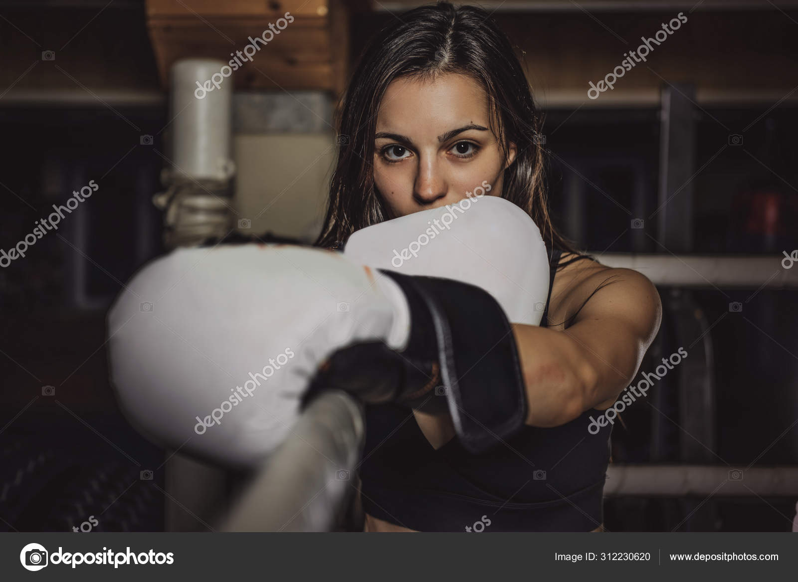 Portrait of brunette female boxer Stock Photo by ©fxquadro 312230620