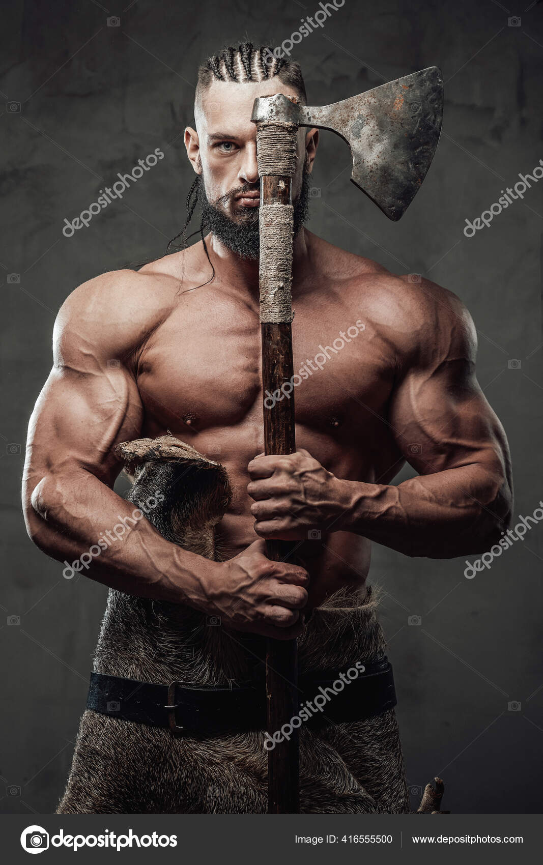 Muscular guy dressed like viking posing in dark background Stock Photo ...