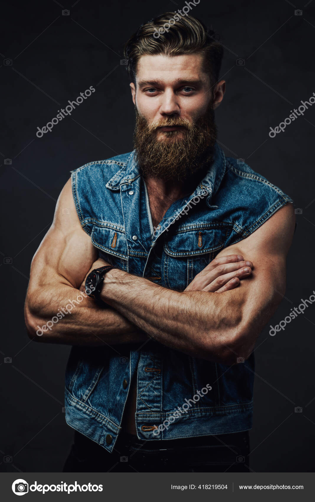 Fashionable guy with muscular hands posing in studio Stock Photo by ...
