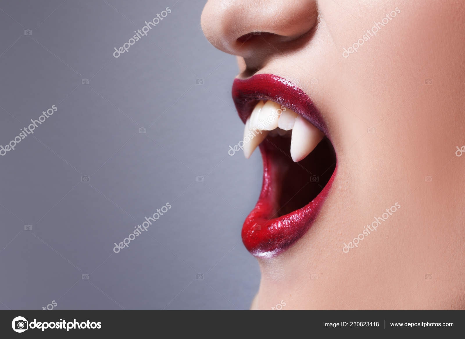 Sexy vampire. Women's lips with red lipstick. Screaming mouth with ...