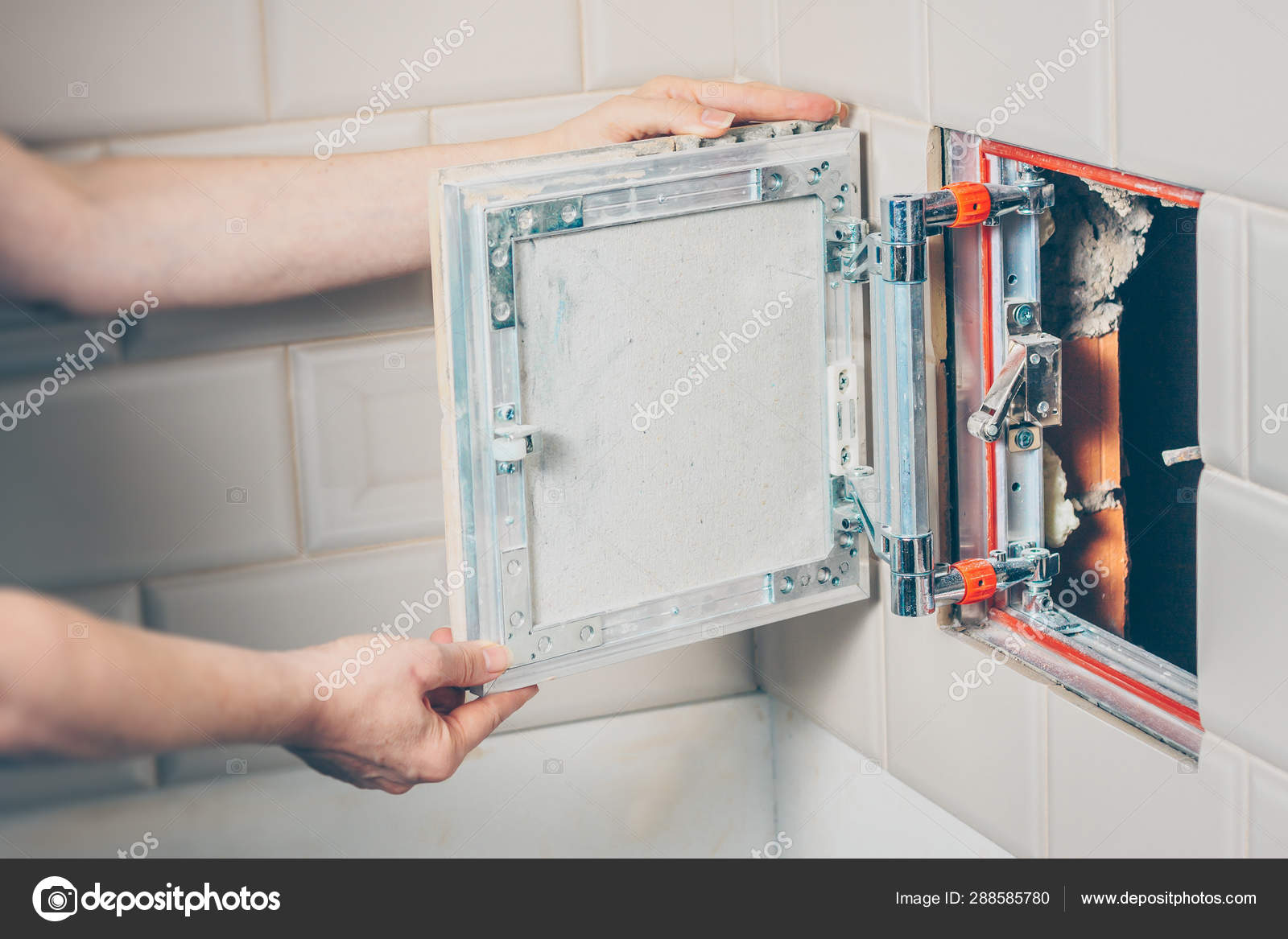 Girl Opens Hidden Hatch Wall Tiles Stock Photo by ©andreygonchar 288585780