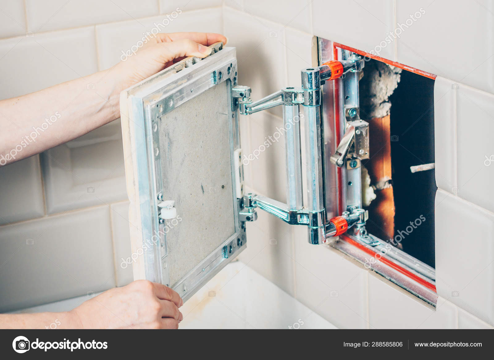 Girl Opens Hidden Hatch Wall Tiles Stock Photo by ©andreygonchar 288585806