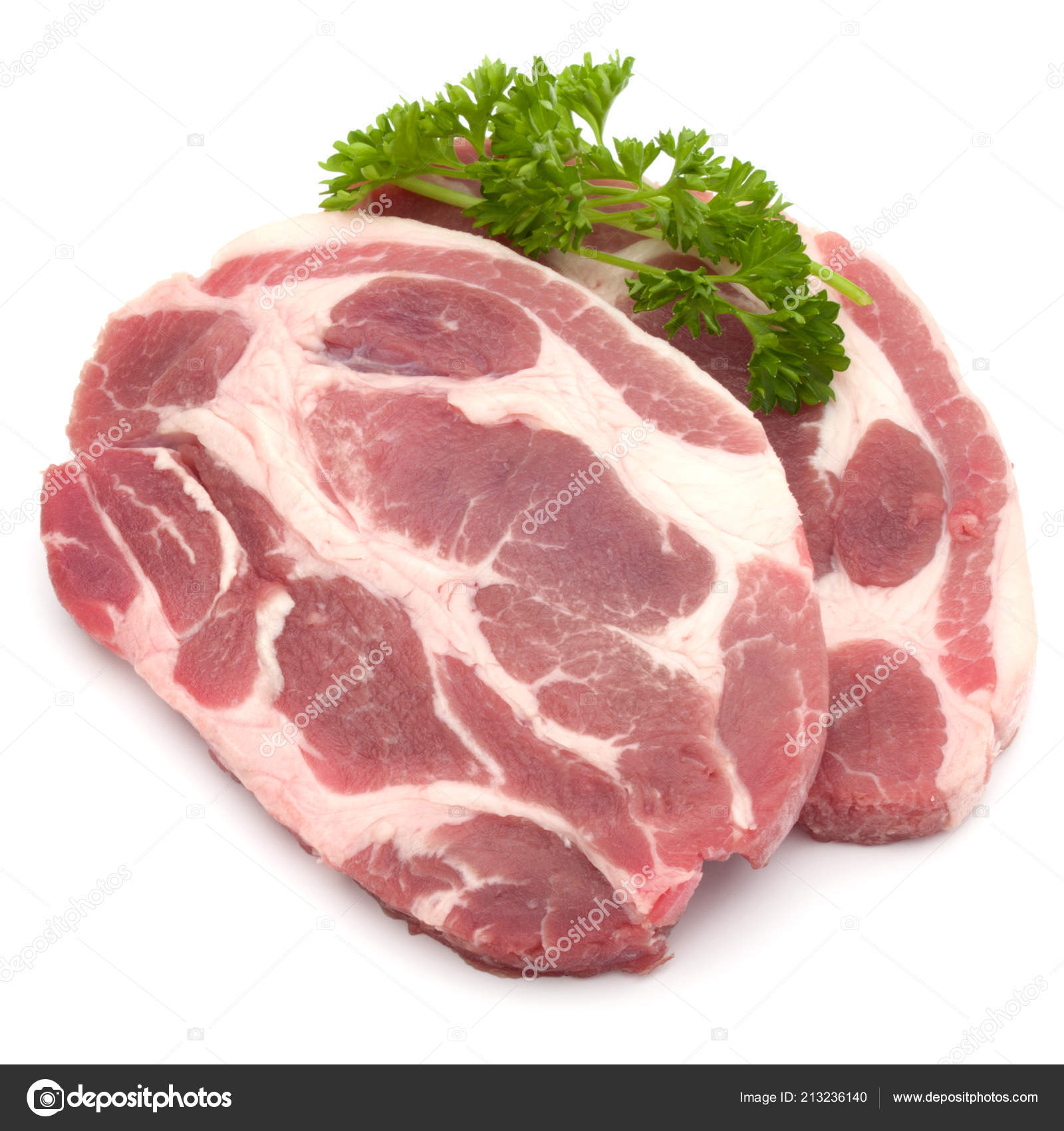 Raw pork neck chop meat with parsley herb leaves garnish isolate Stock ...