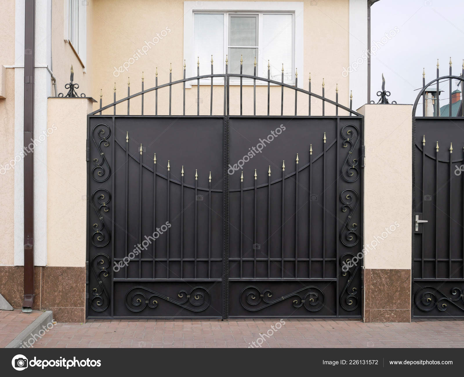 Modern iron gate. Facade. Stock Photo by ©Blulake 226131572