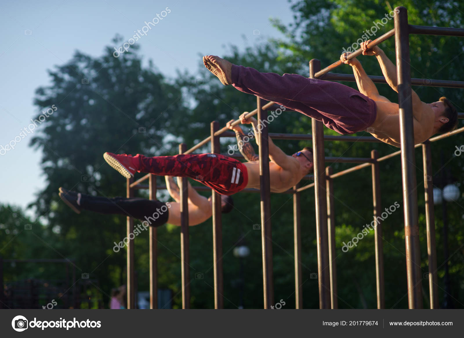 Three Muscular Men Making Workout Horizontal Bar Street Stock Photo by ...