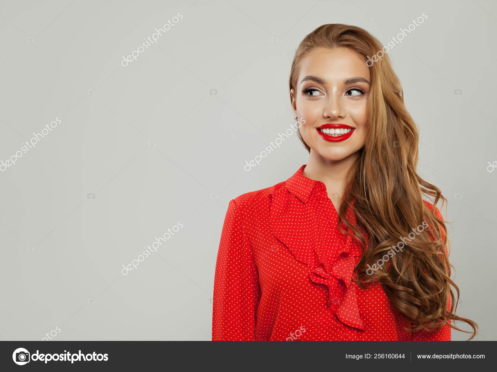 Beautiful happy model smiling and looking aside on white Stock Photo by ...