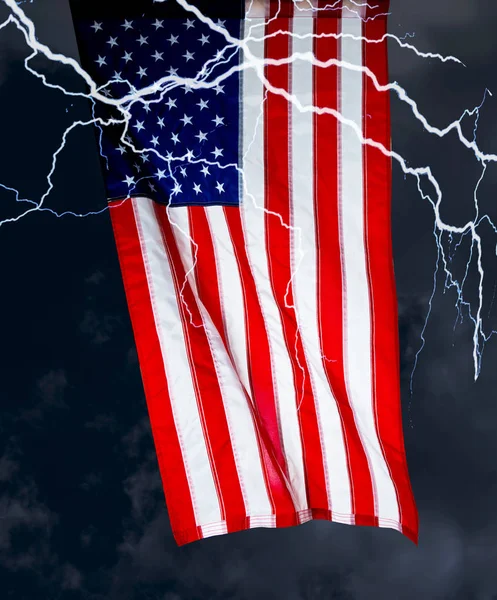 United States of America flag flown in sky with storm and lightning ...