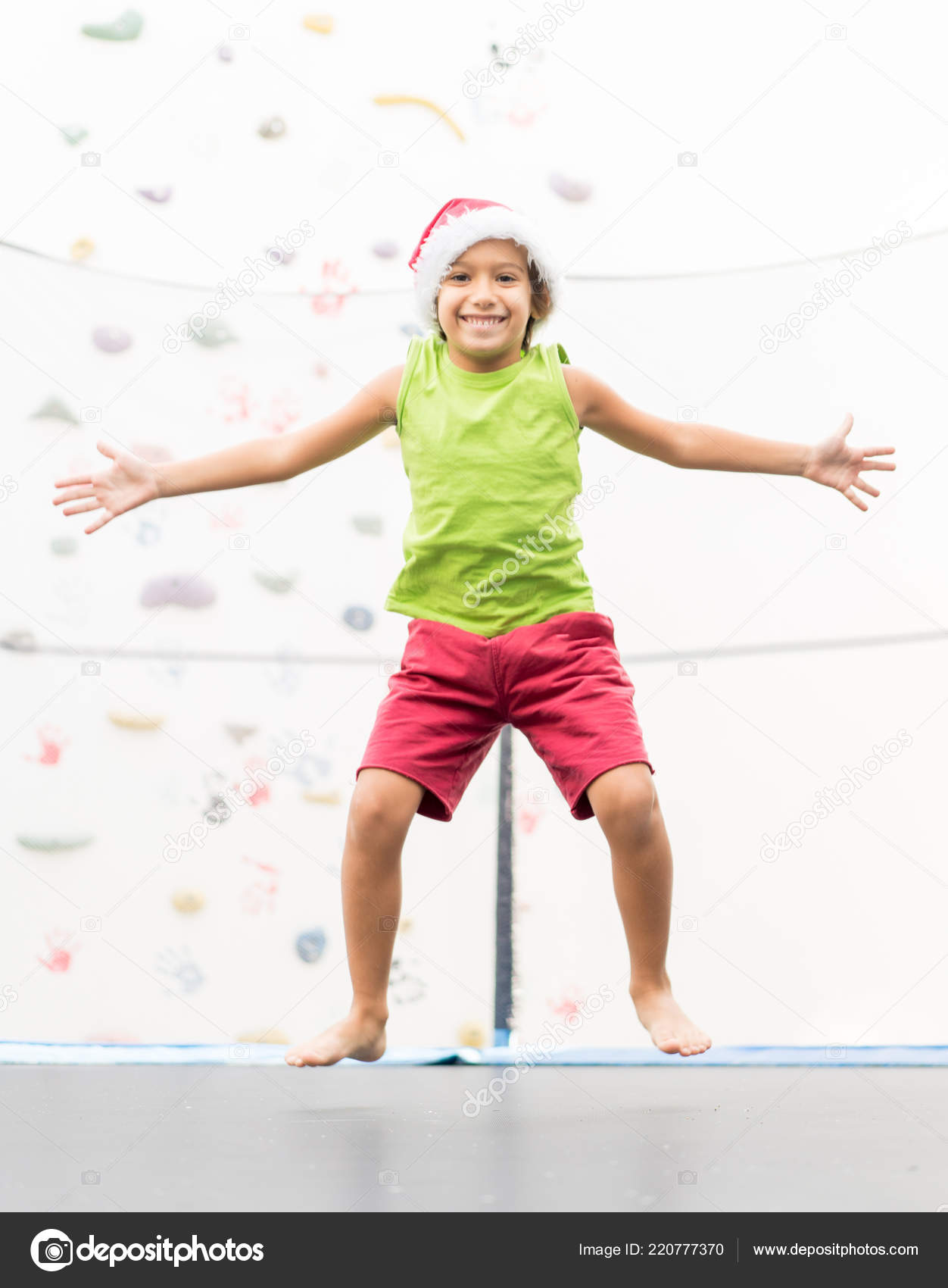 Little Boy Santa Hat Jumping Trampoline Stock Photo by ©zurijeta 220777370