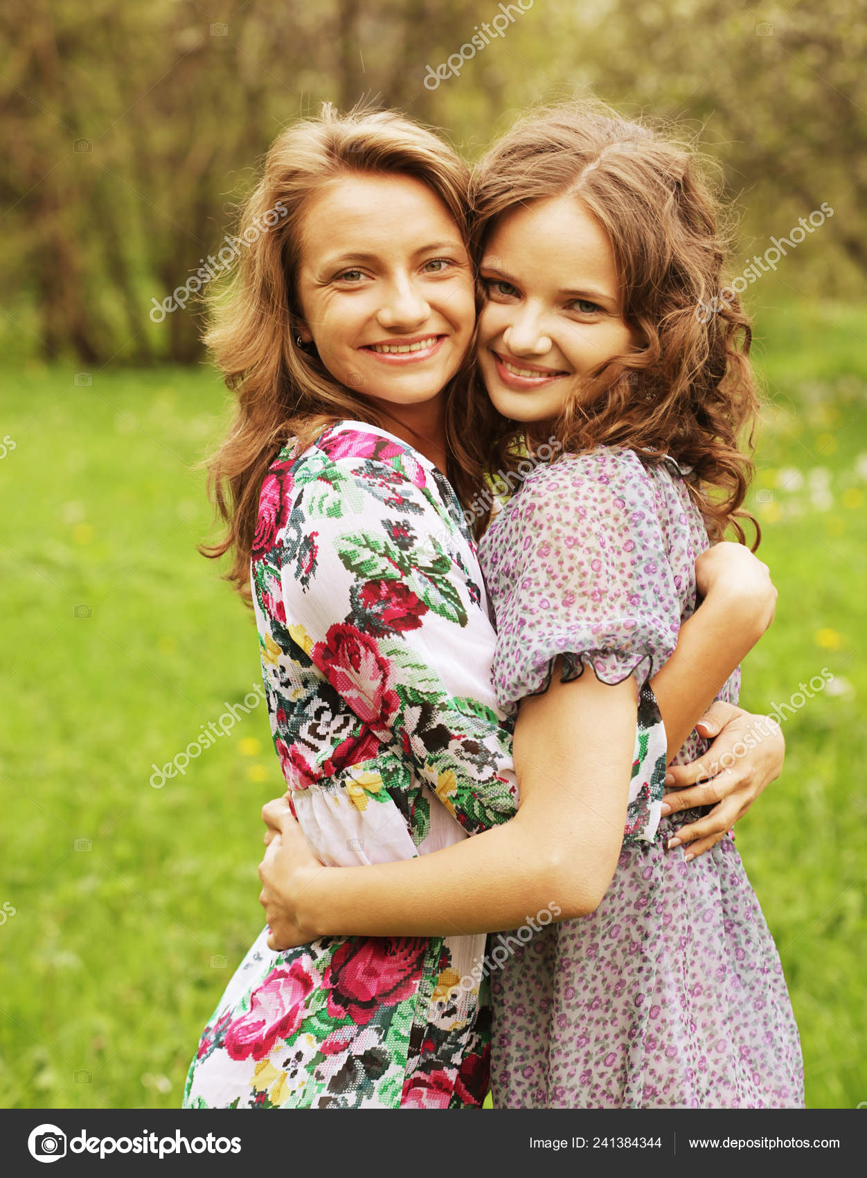 Young pretty girlfriends over nature background — Stock Photo ...