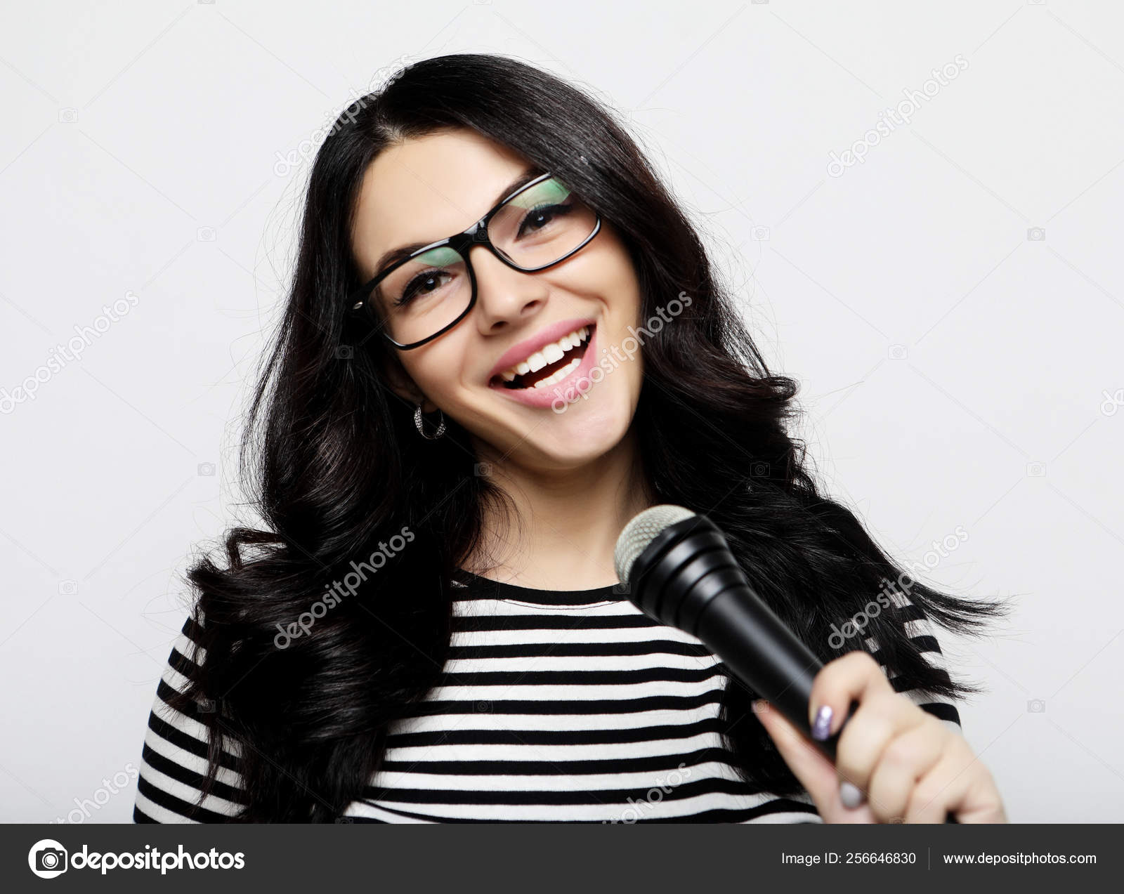 Beauty model girl singer with a microphone Stock Photo by ©kanareva ...