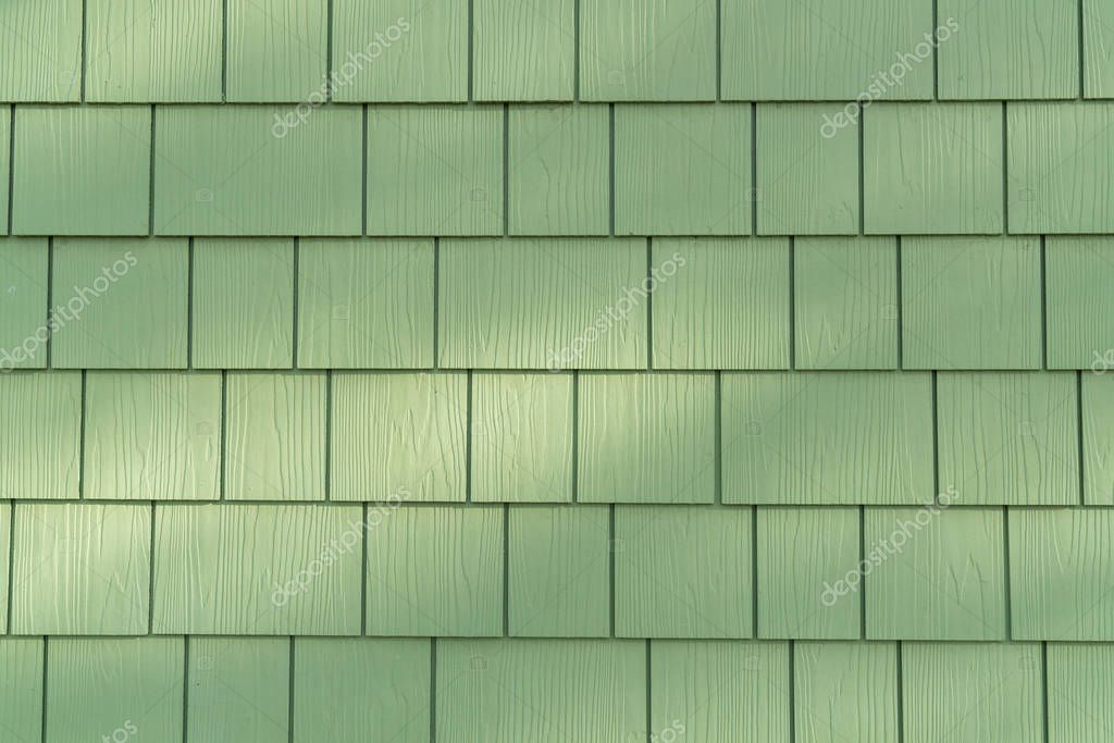 Fondo de la pared con tejas de cedro verde 2024