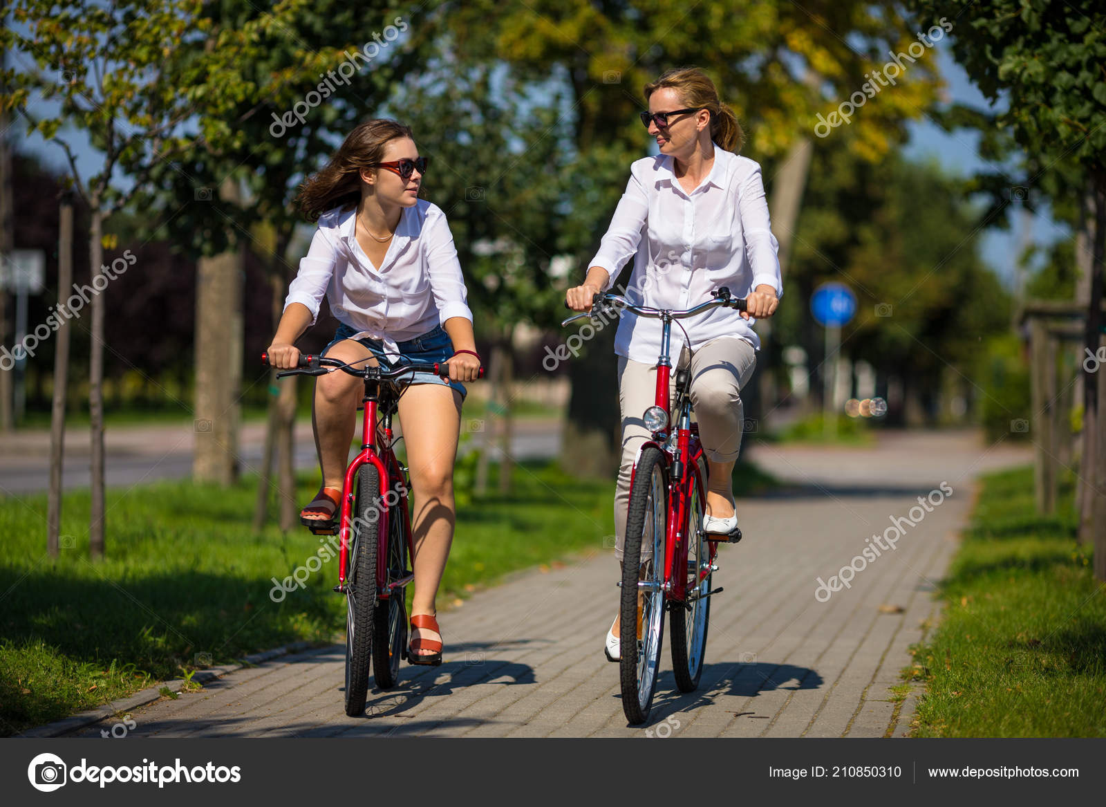 Two Women Riding Bicycles Together Park Sport Activity Concept — Stock ...