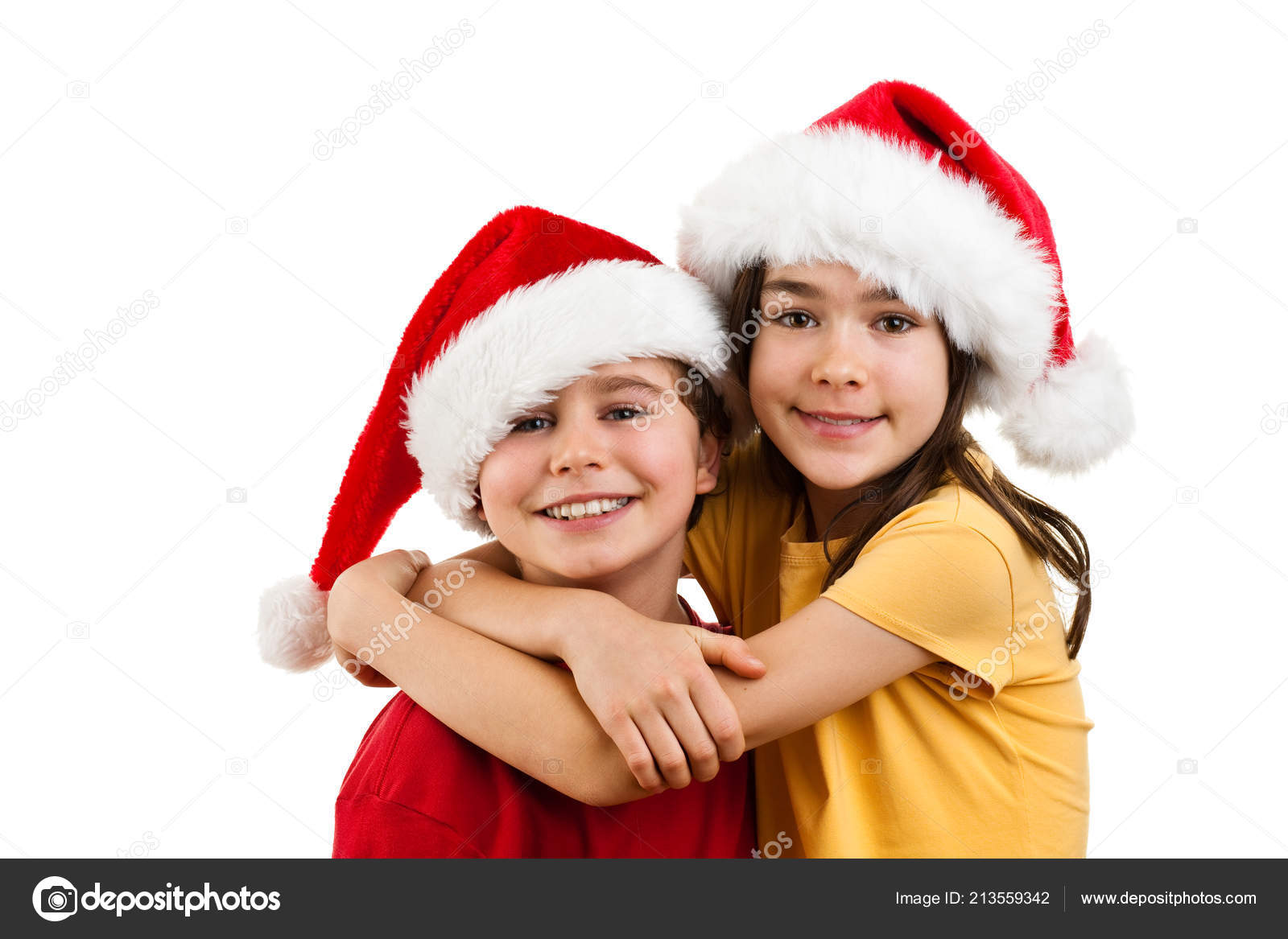 Boy and girl in Santa's hats Stock Photo by ©gbh007 213559342