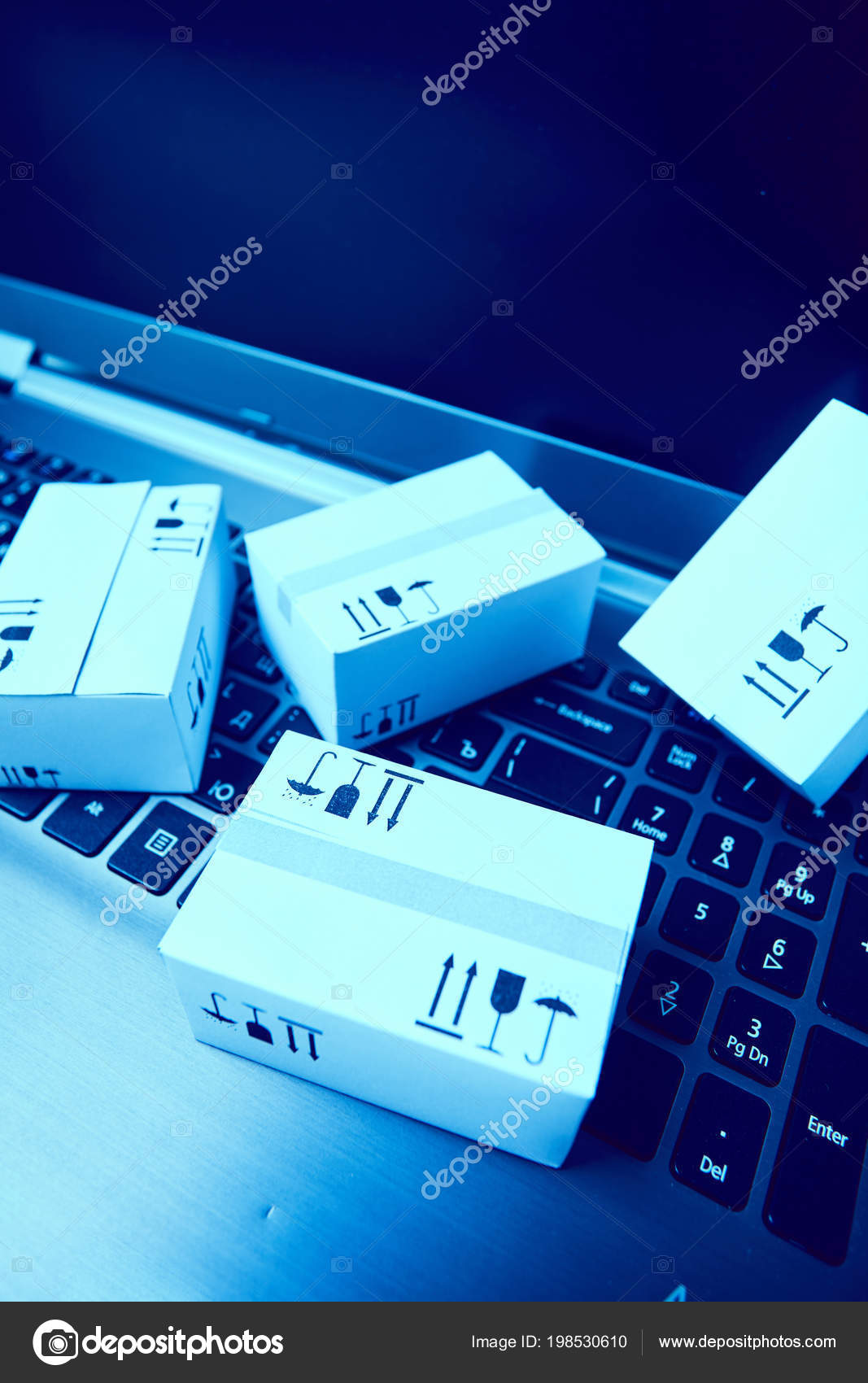 Delivery Packaging Boxes Laptop Keyboard Stock Photo by ©strelok 198530610