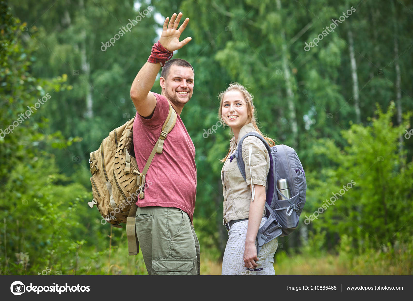Two Travelers Walking Forest Sunny Day Stock Photo by ©strelok 210865468