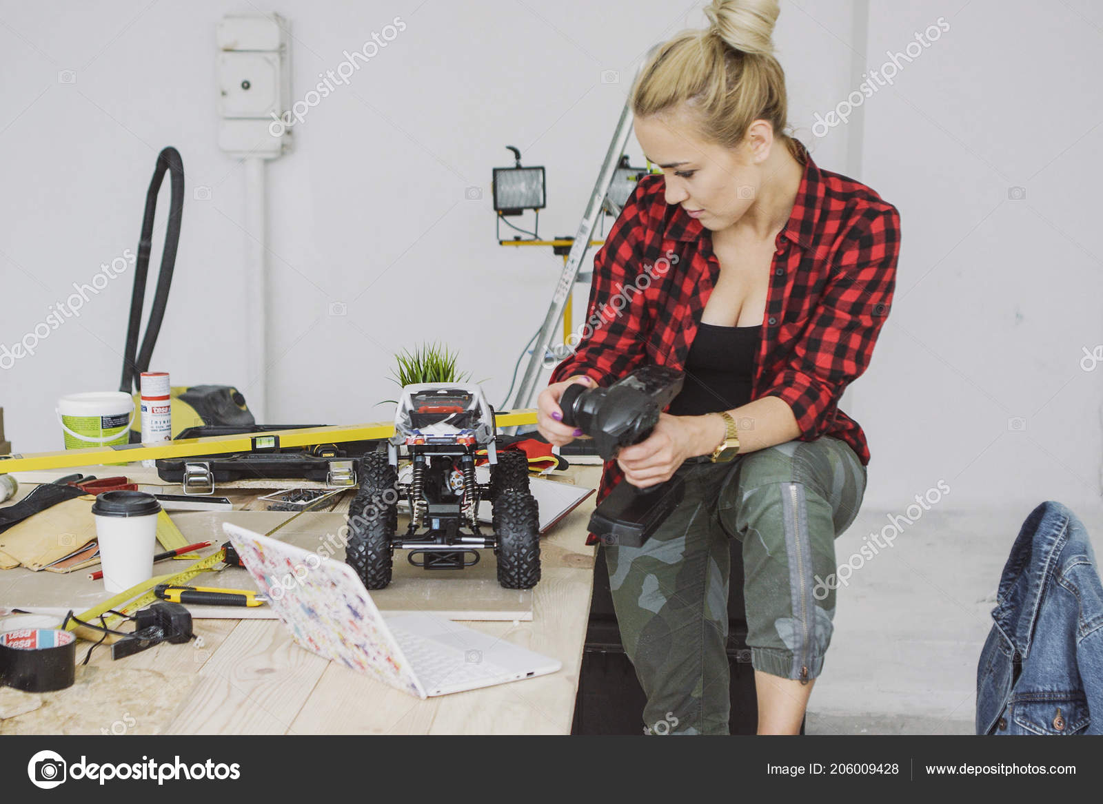 Female checking functions of radio-controlled car — Stock Photo ...