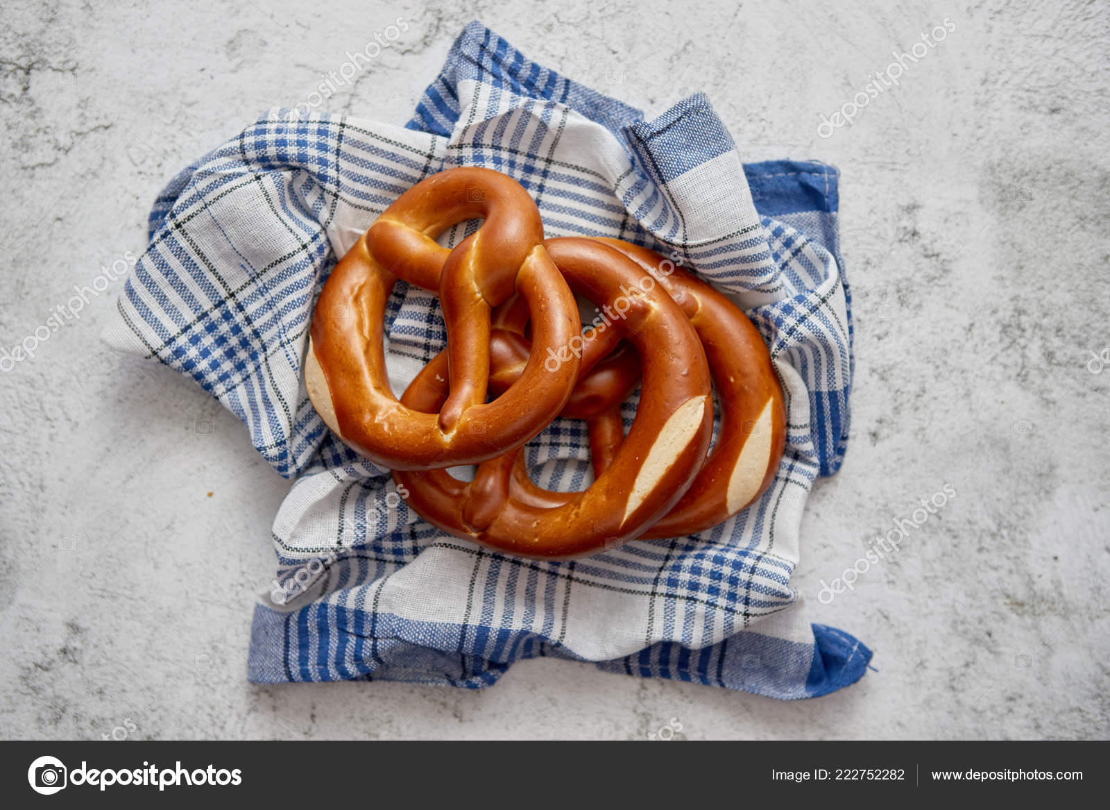 Three german fresh baked pretzel buns placed on napkin Stock Photo by ...
