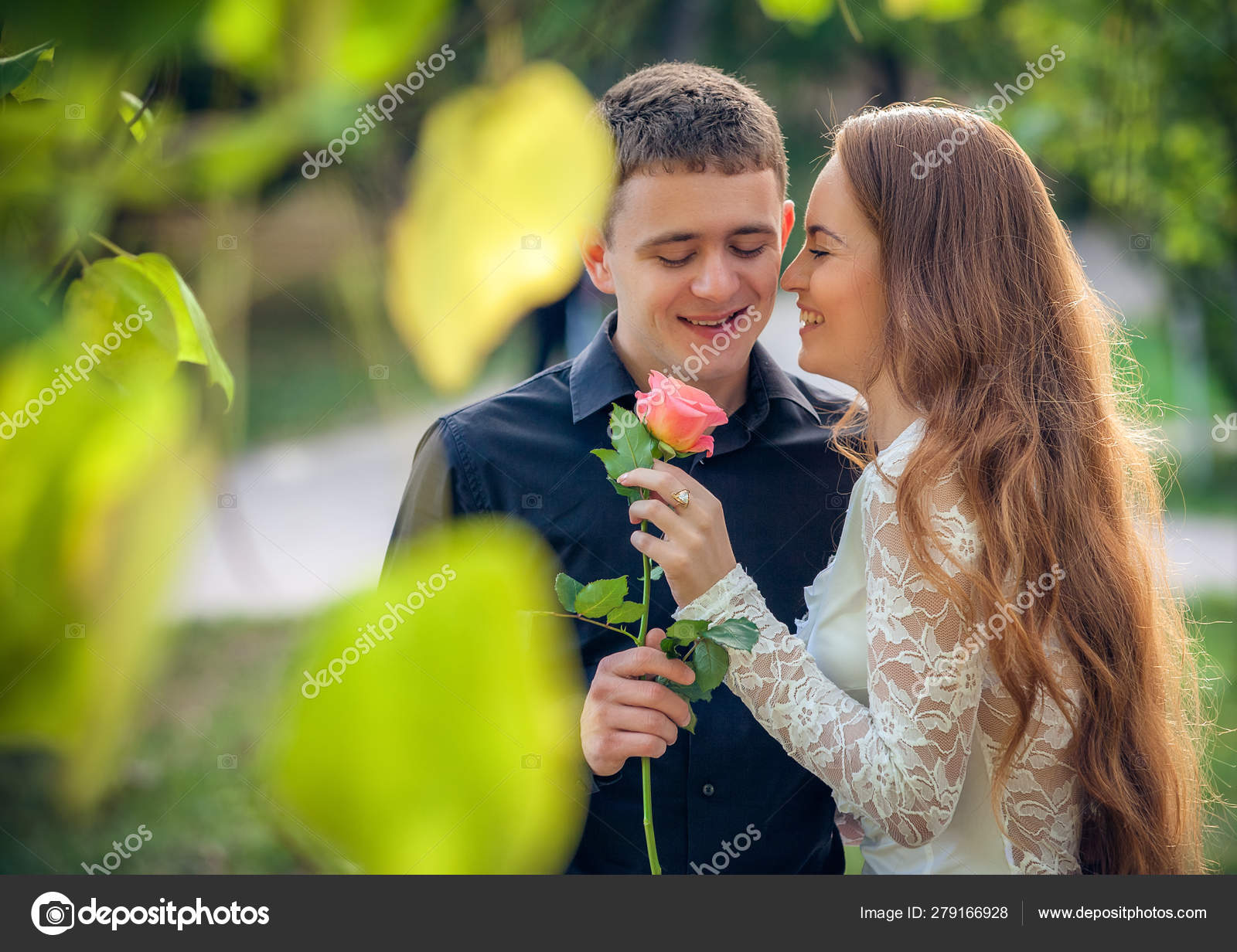 Love and affection between a young couple at the park — Stock Photo ...