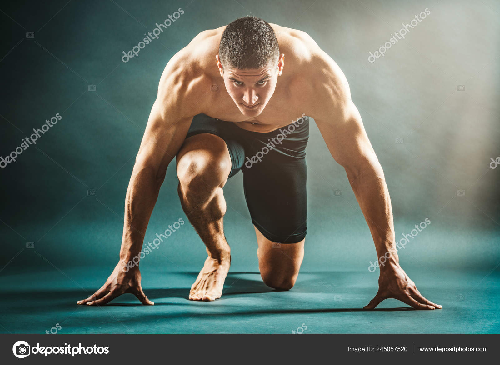 Strong Muscular Man Kneeling Floor Stock Photo by ©MilanMarkovic 245057520